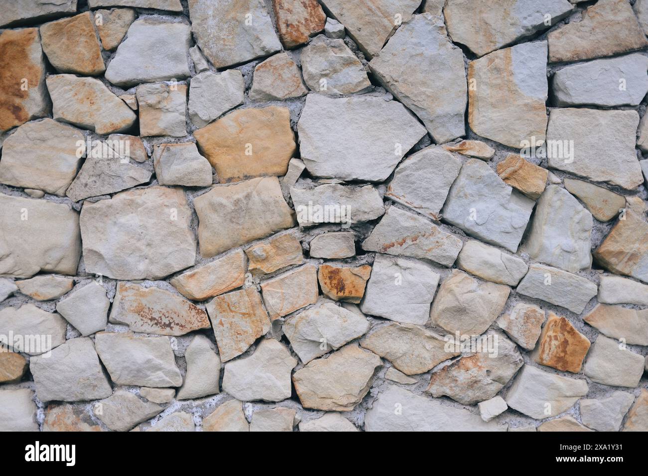 The various sized stones form a wall Stock Photo - Alamy