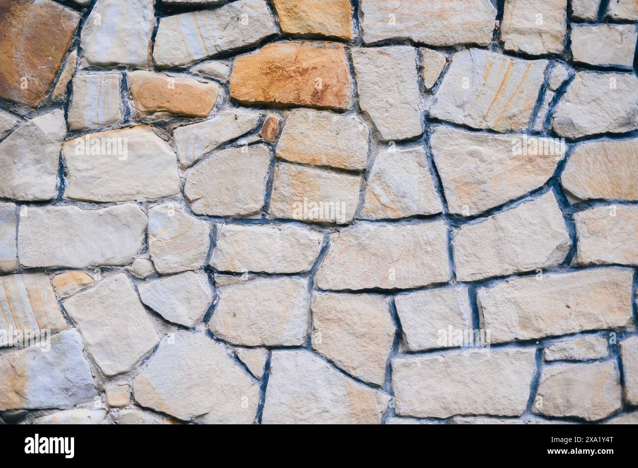 The various sized stones form a wall Stock Photo - Alamy