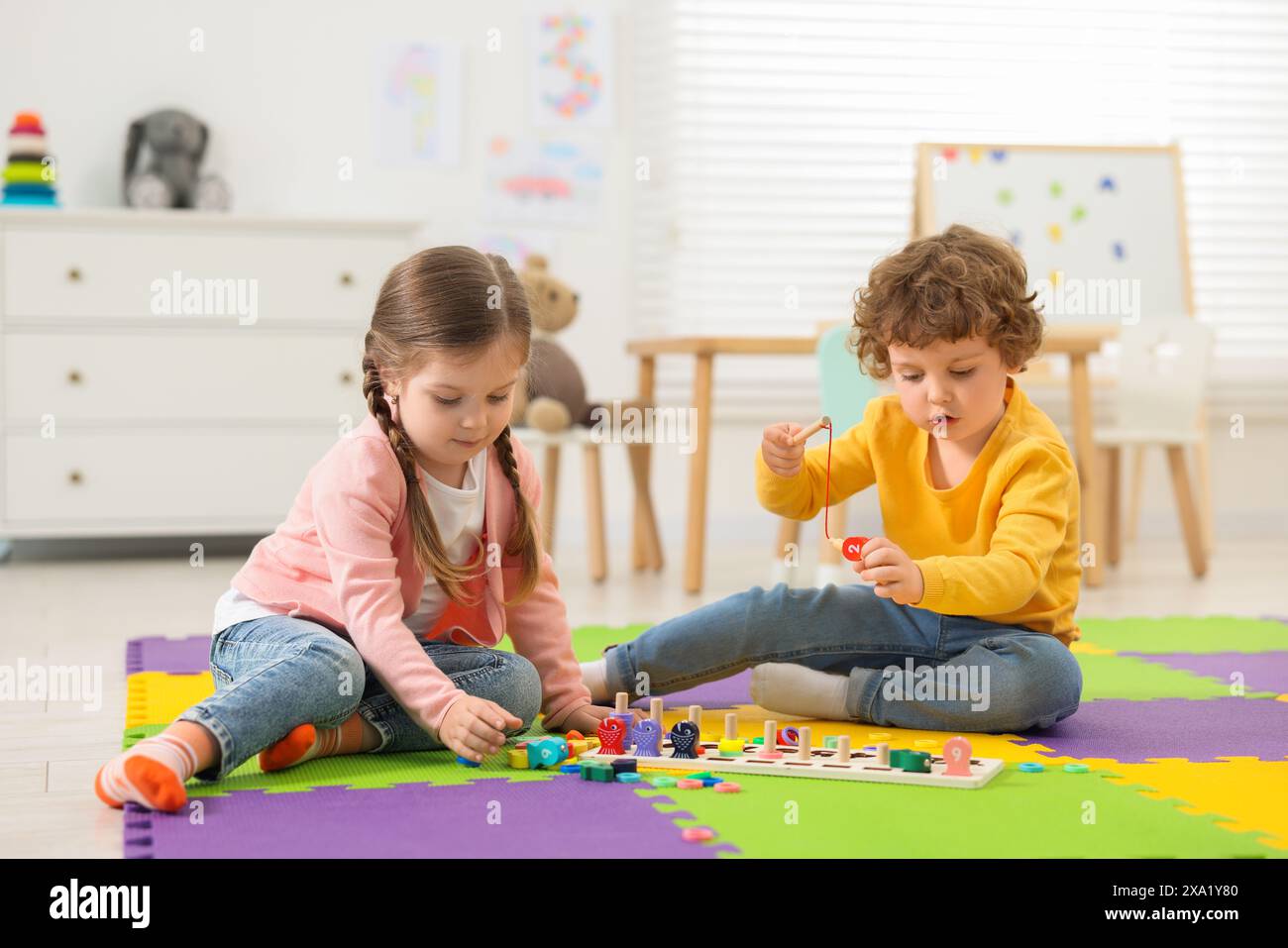 Cute little children playing with math game Fishing for Numbers on ...