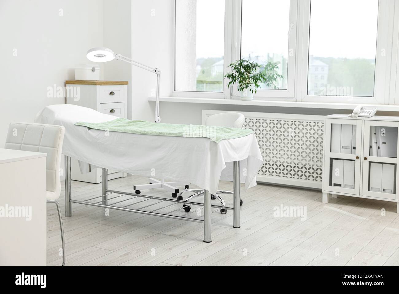 Modern interior of dermatologist's office with examination table Stock ...