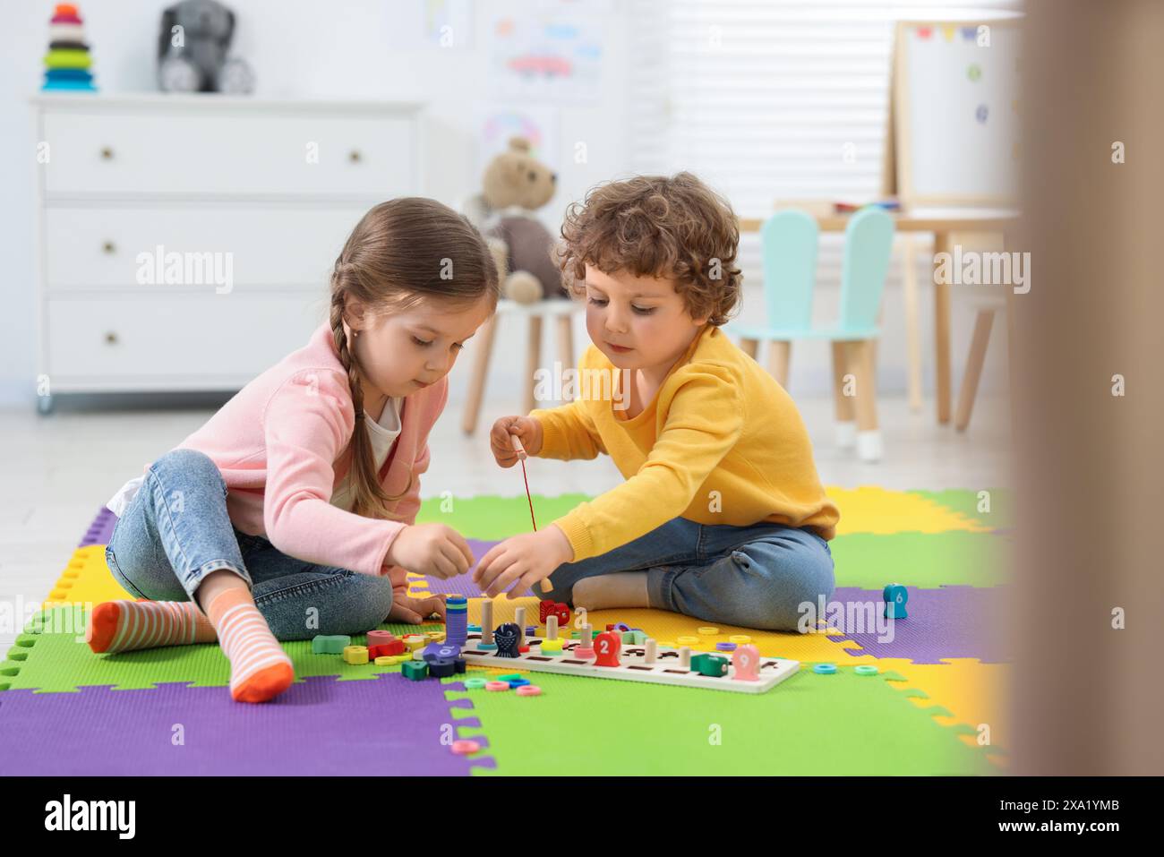 Cute little children playing with math game Fishing for Numbers on ...