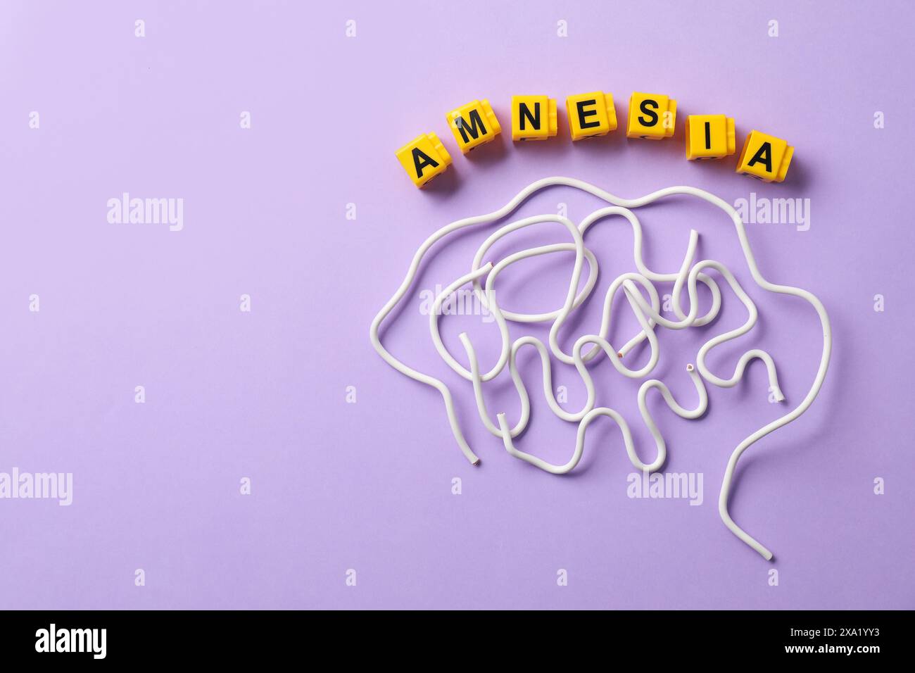Word Amnesia and brain made of wires on violet background, flat lay ...