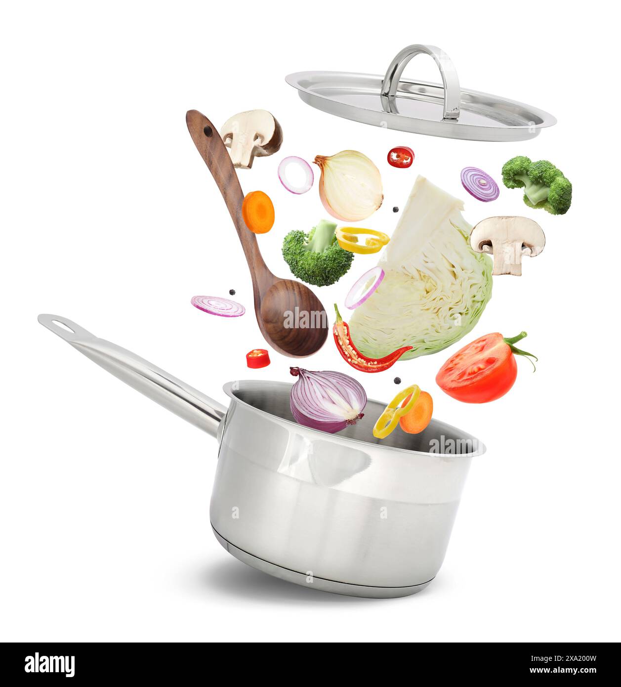 Fresh ingredients falling into saucepan on white background Stock Photo ...
