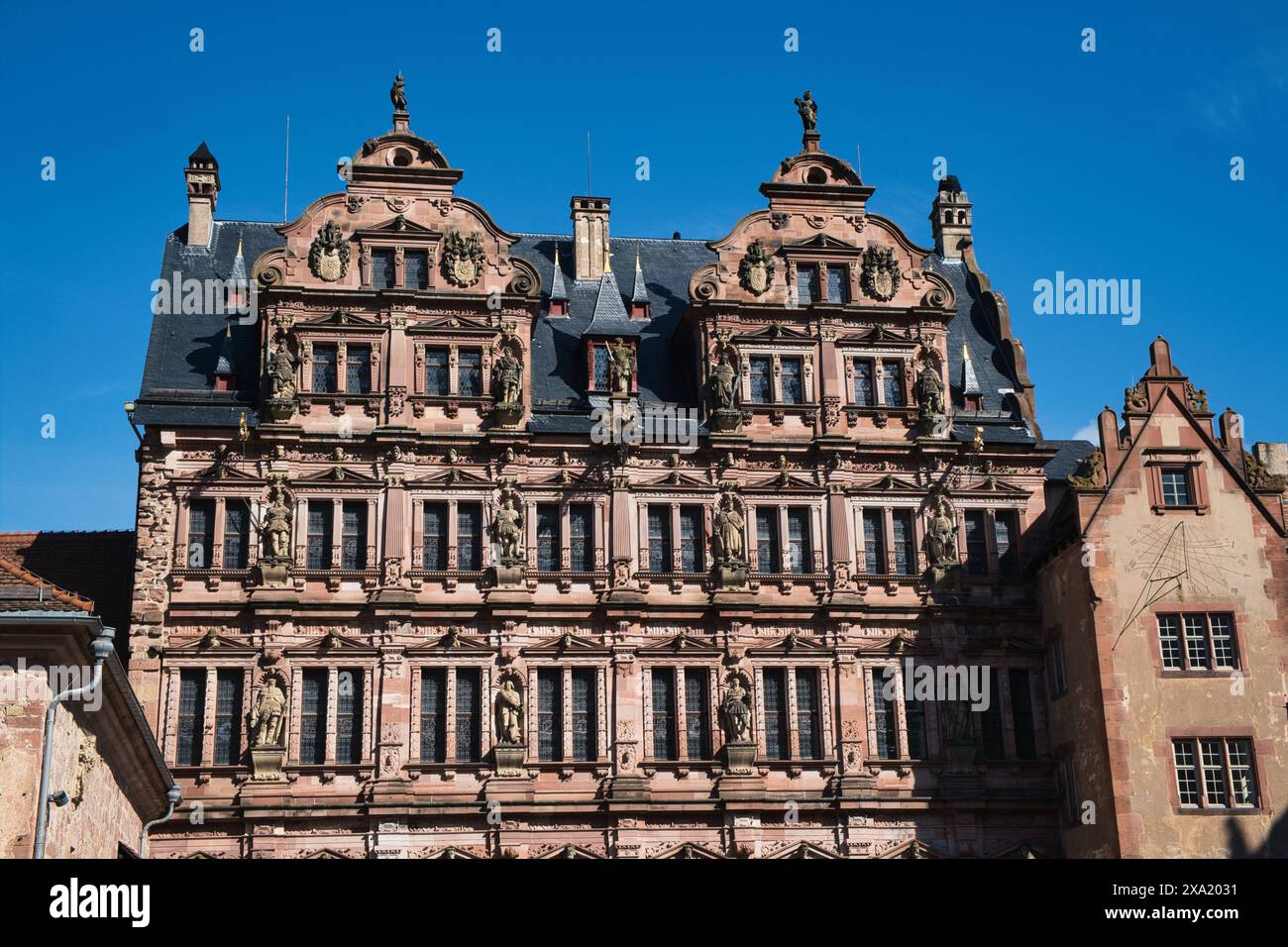 A building adorned in pink and blue hues with decorative accents ...