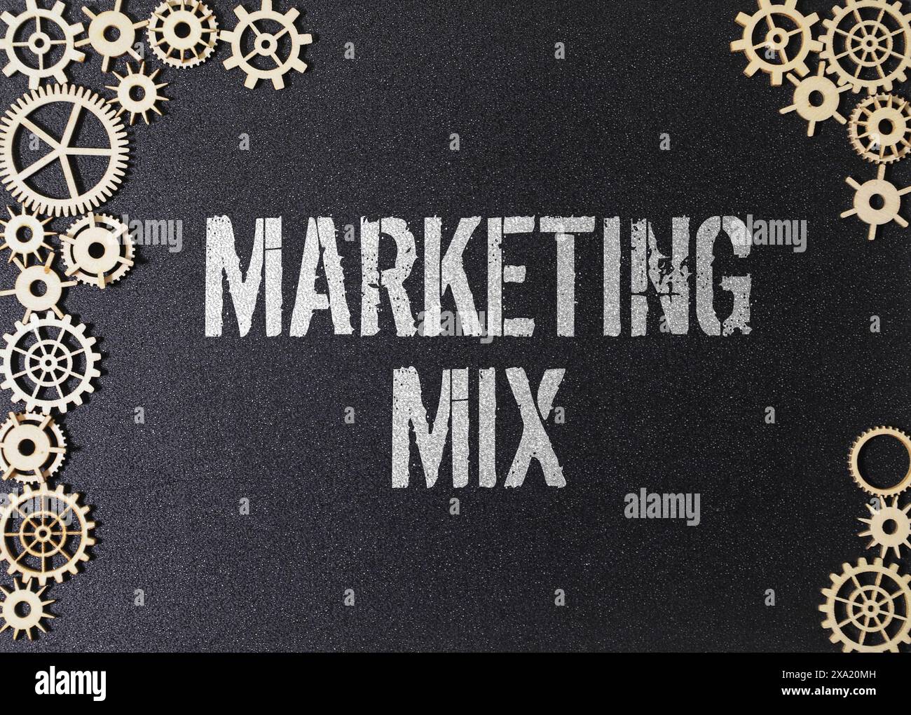MARKETING MIX word written on wood block. MARKETING MIX text on cement ...