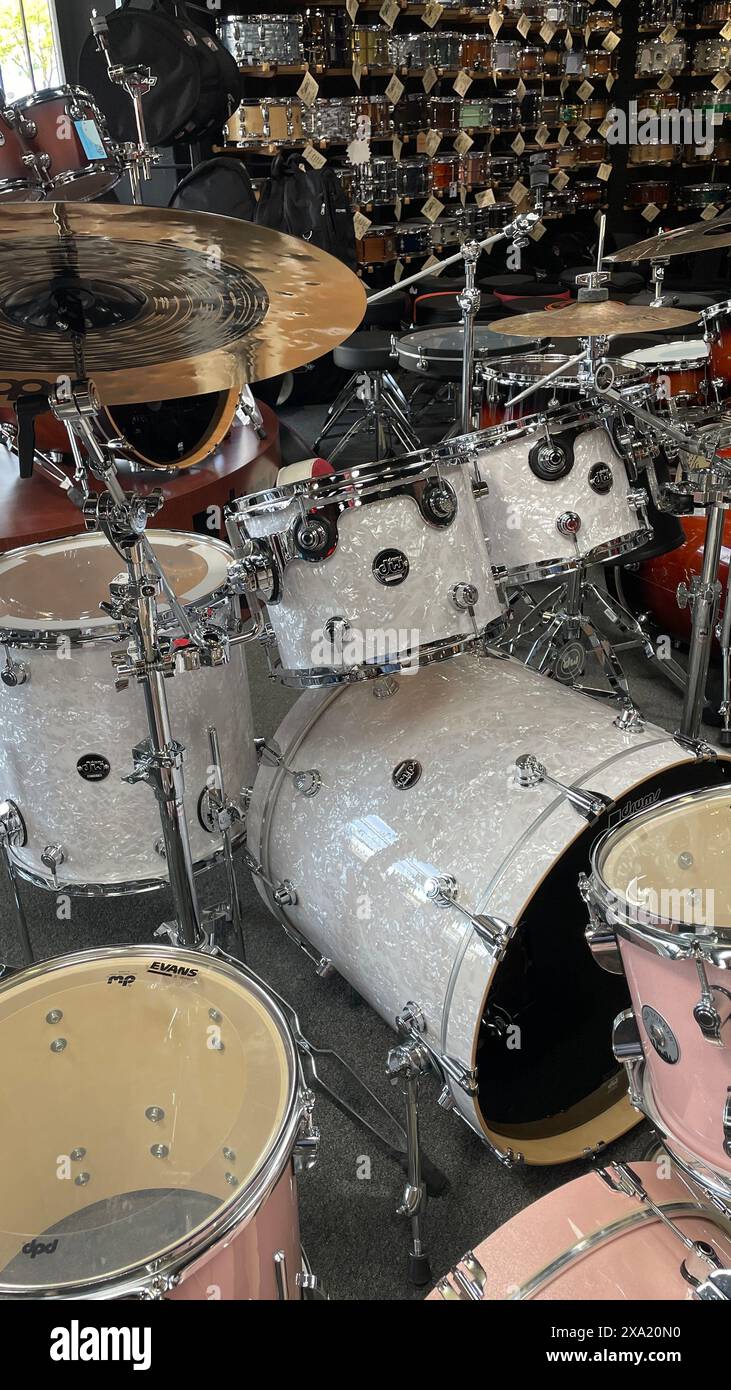 A photo of White shiny Drums on display in Drum Store Stock Photo - Alamy