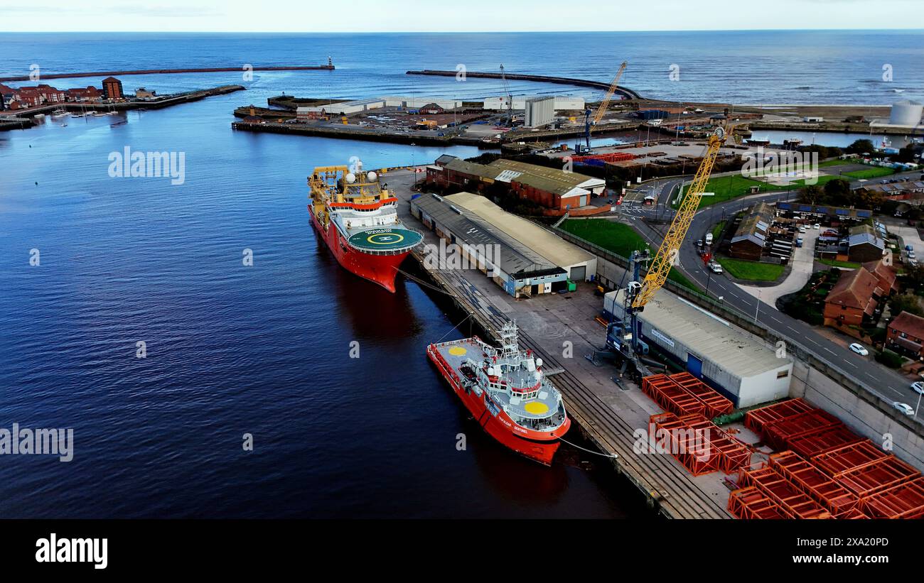 A big ship in a vast water body with multiple trucks on board Stock ...