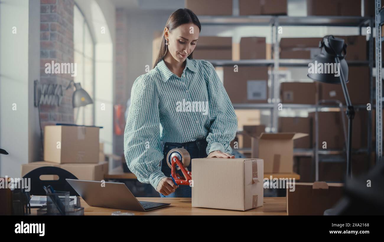 Beautiful Storeroom Worker Preparing a Small Parcel for Postage ...