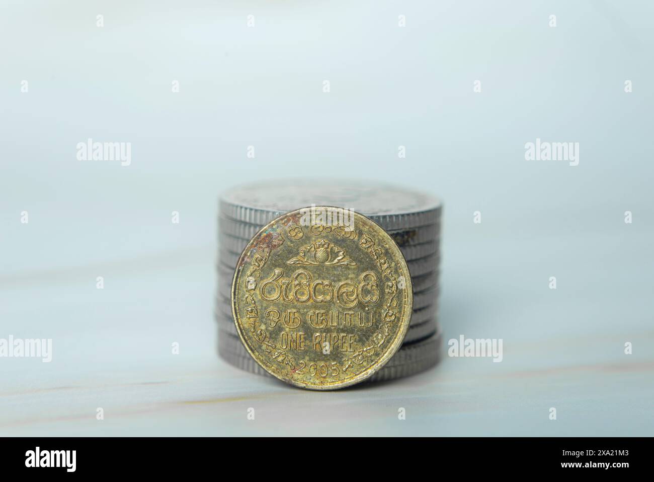 A stack of Nepalese one-rupee coins Stock Photo - Alamy