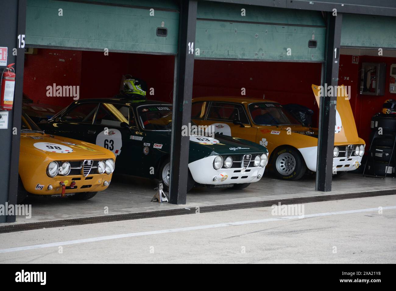 Colorful cars parked in a garage on the ground Stock Photo - Alamy