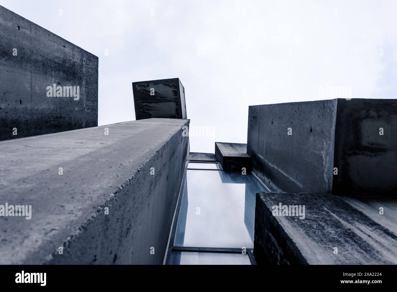 Concrete blocks on either side against sky backgroundv Stock Photo - Alamy