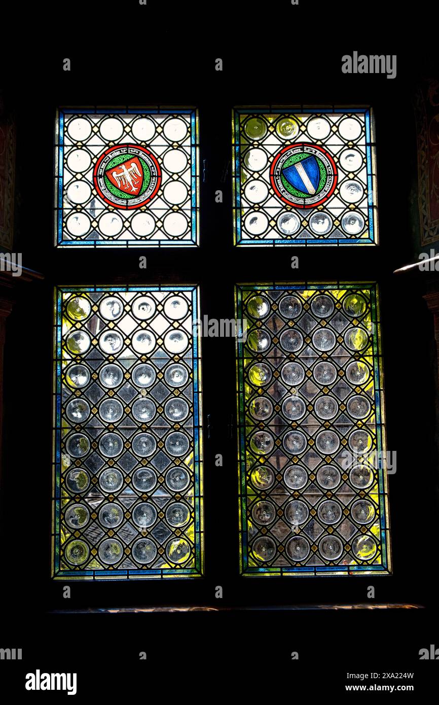 Three colorful stained glass windows at building entrance Stock Photo ...
