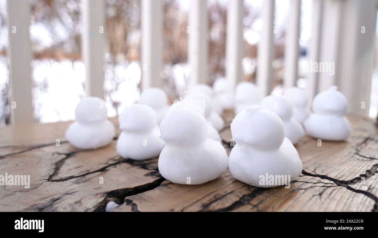 Wooden snowmen decorations on table Stock Photo - Alamy