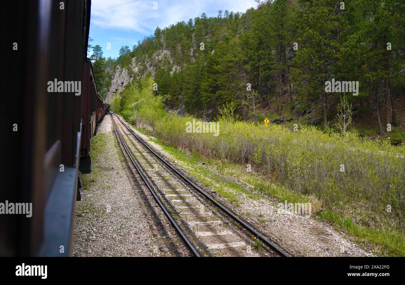 Train approaching end of a track, moving forward Stock Photo - Alamy