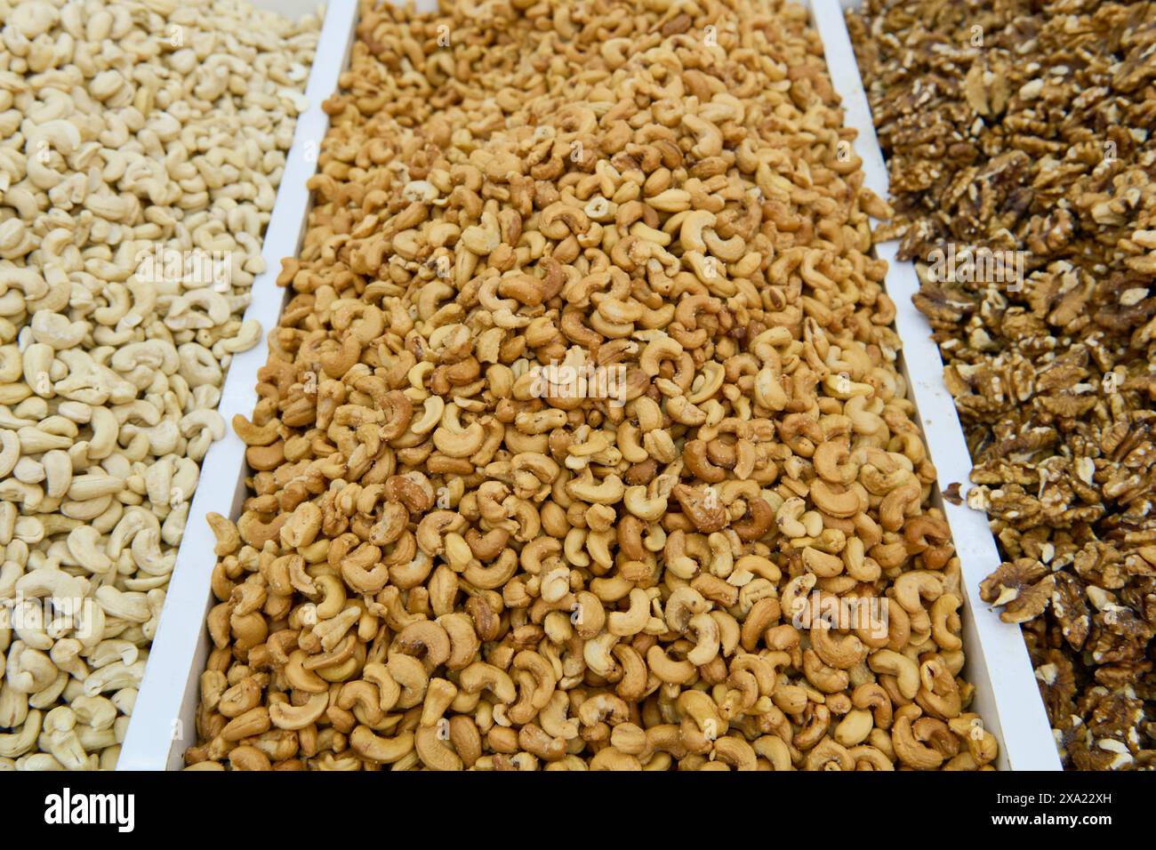 Assorted nuts and seeds in display cases Stock Photo - Alamy