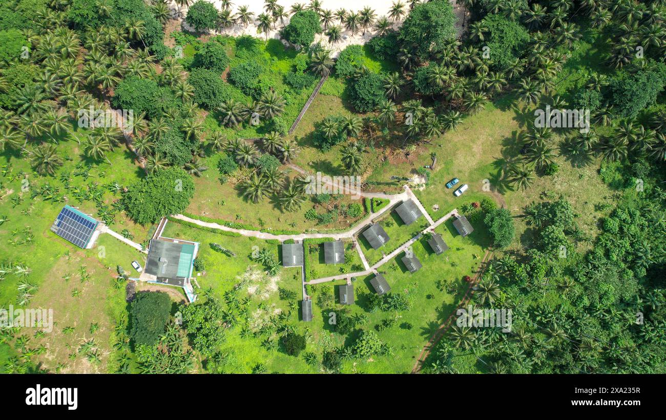 An aerial view of solar panel roof bungalows at a resort in Sao Tome ...