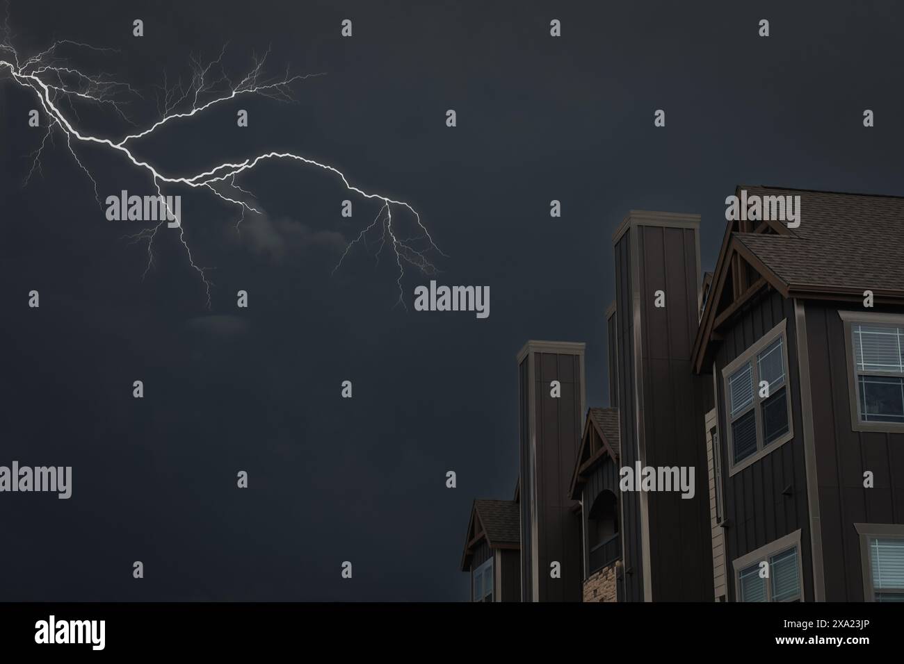 The lightning in the night sky above residential buildings Stock Photo ...