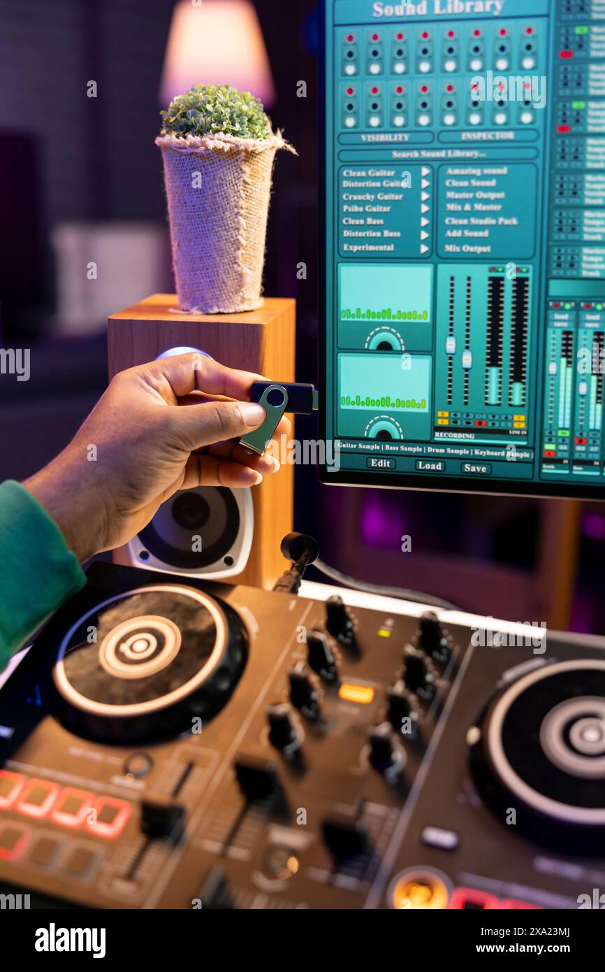 Professional artist inserting an usb stick in the computer to edit ...