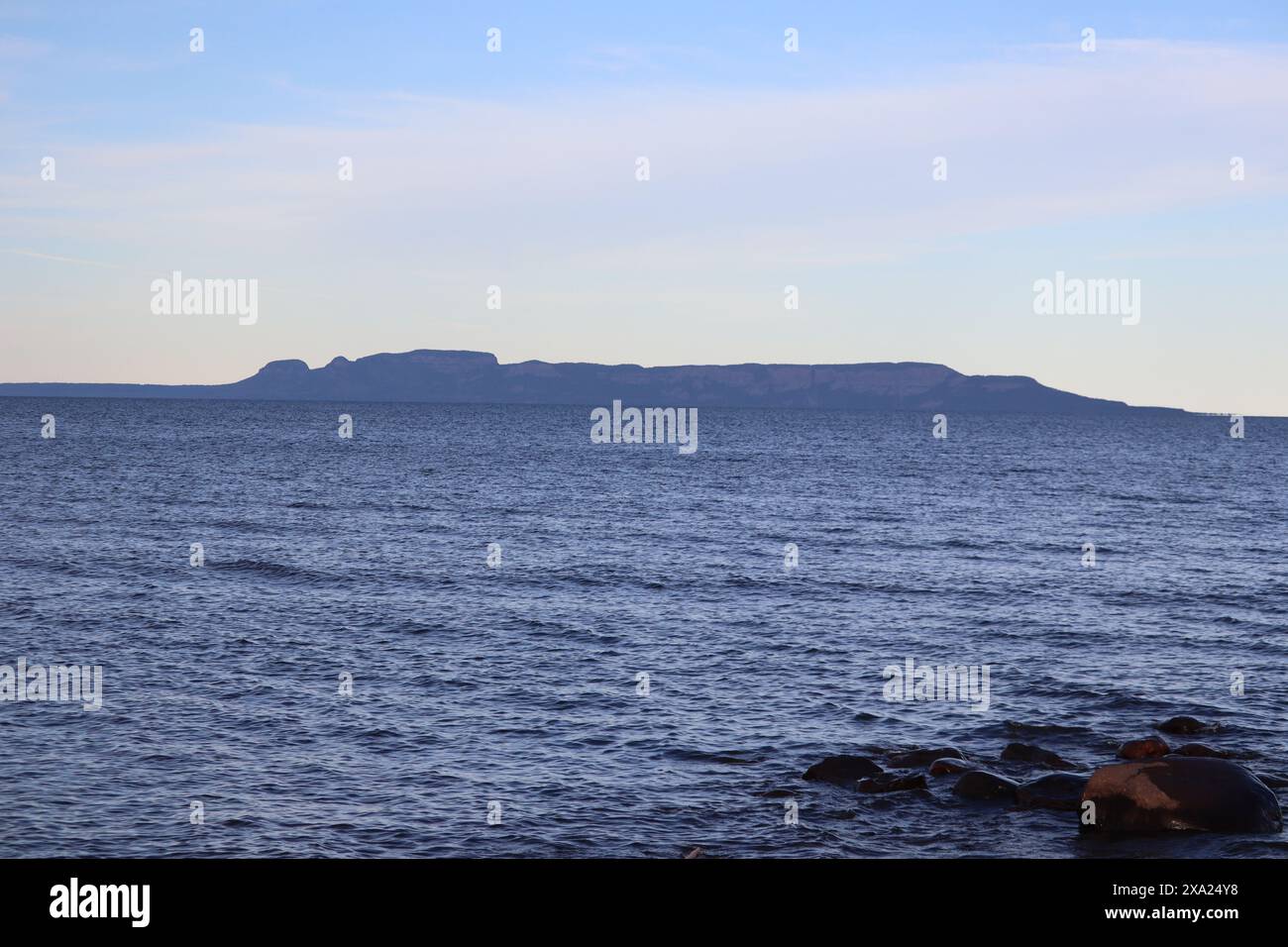 The majestic mountains meet the vast ocean Stock Photo - Alamy