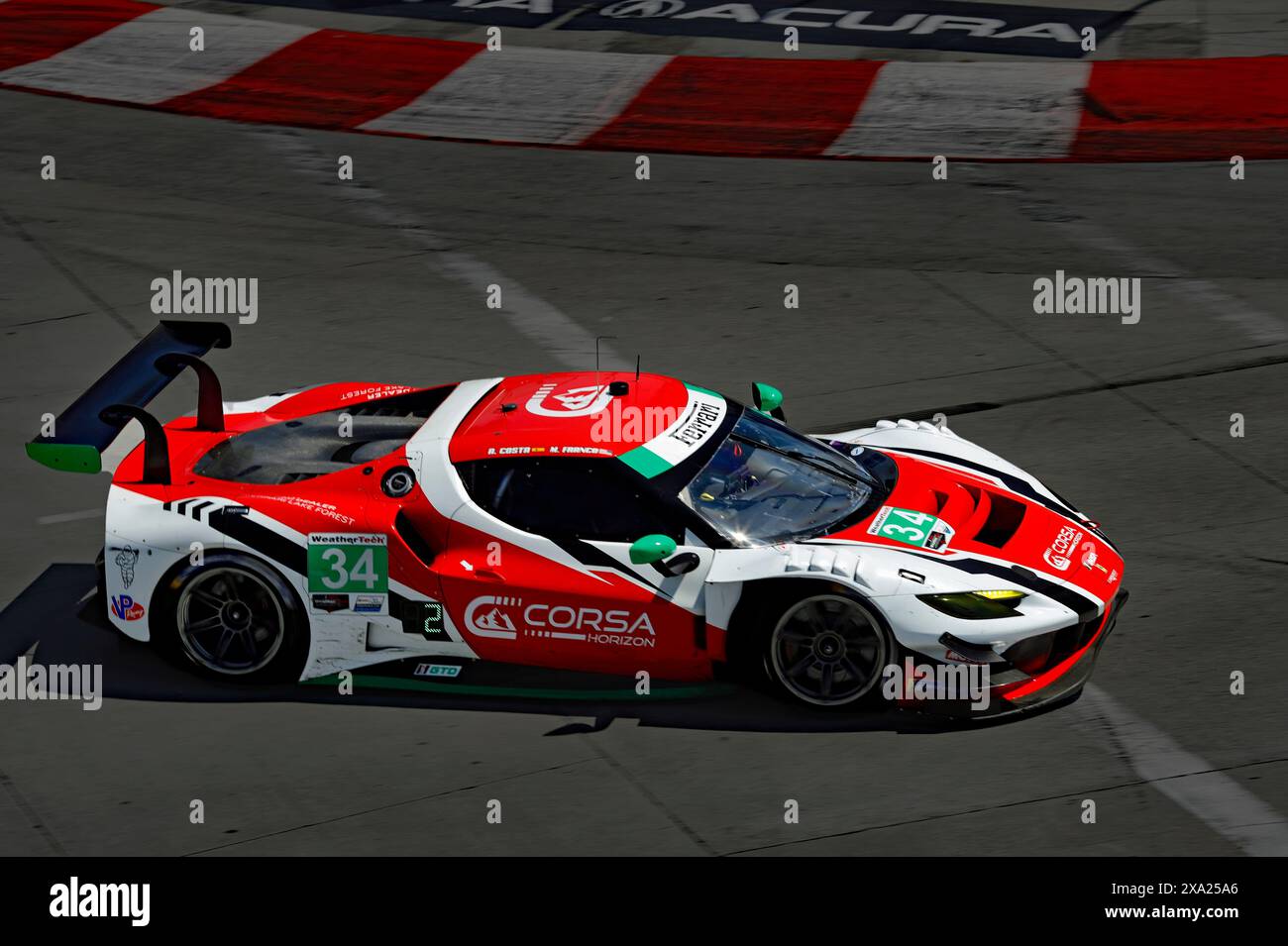 A Ferrari racing car speeding on a track Stock Photo - Alamy
