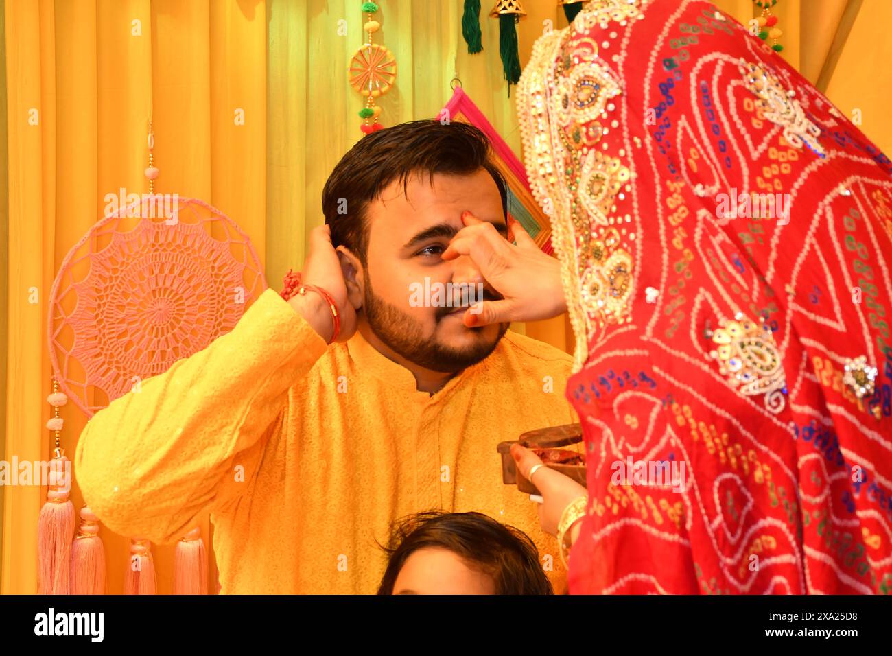An Indian Sister gives blessings to the brother by putting tika on his ...