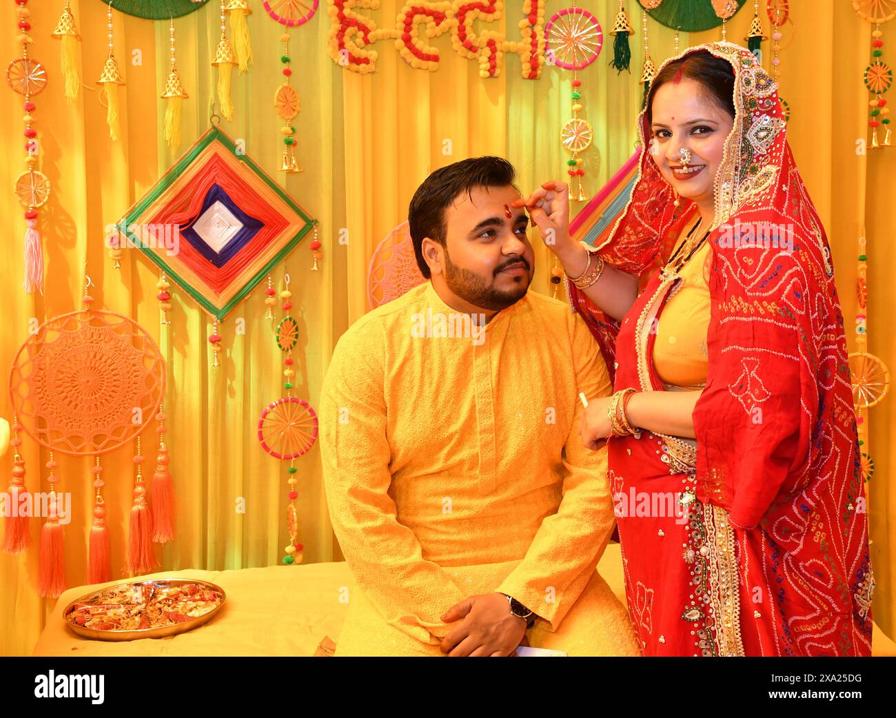 An Indian Sister gives blessings to the brother by putting tika on his ...