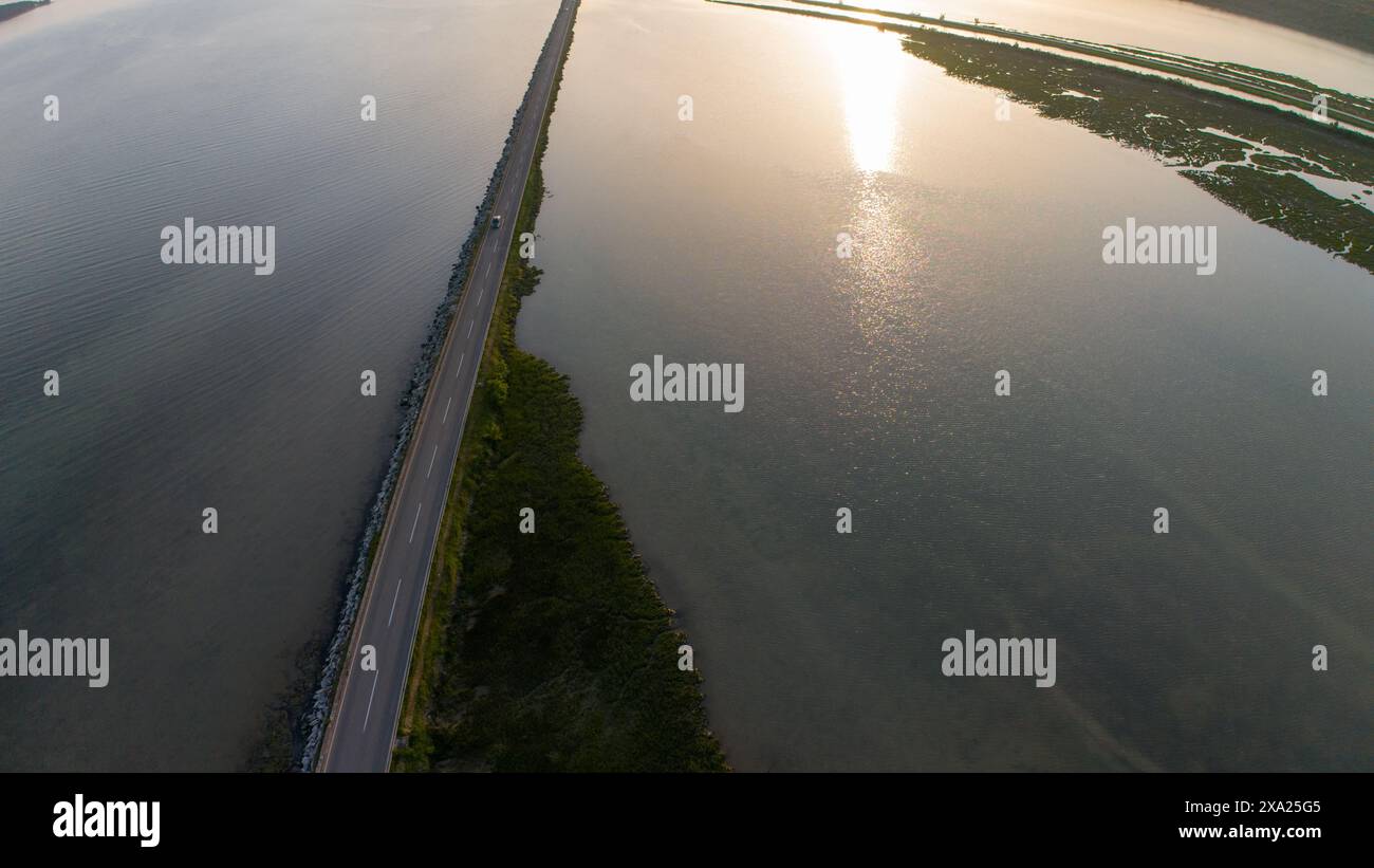 An aerial view of a highway by water and grass Stock Photo - Alamy