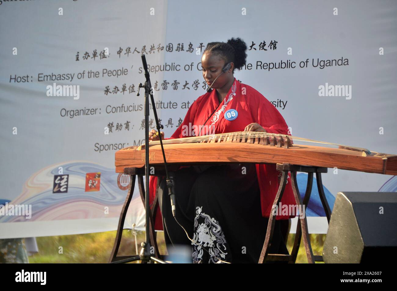 (240604) -- KAMPALA, June 4, 2024 (Xinhua) -- A student plays guzheng, a traditional Chinese ...