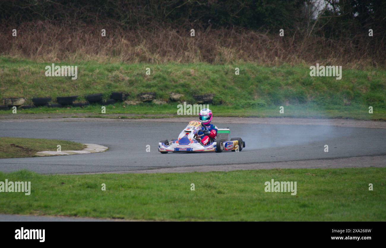 A man compete in a circle track race with a car Stock Photo - Alamy