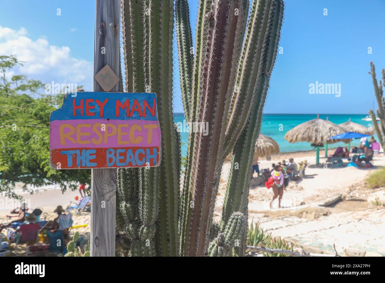 A hand painted sign asks visitors to Respect The Beach at Boca Catalina ...