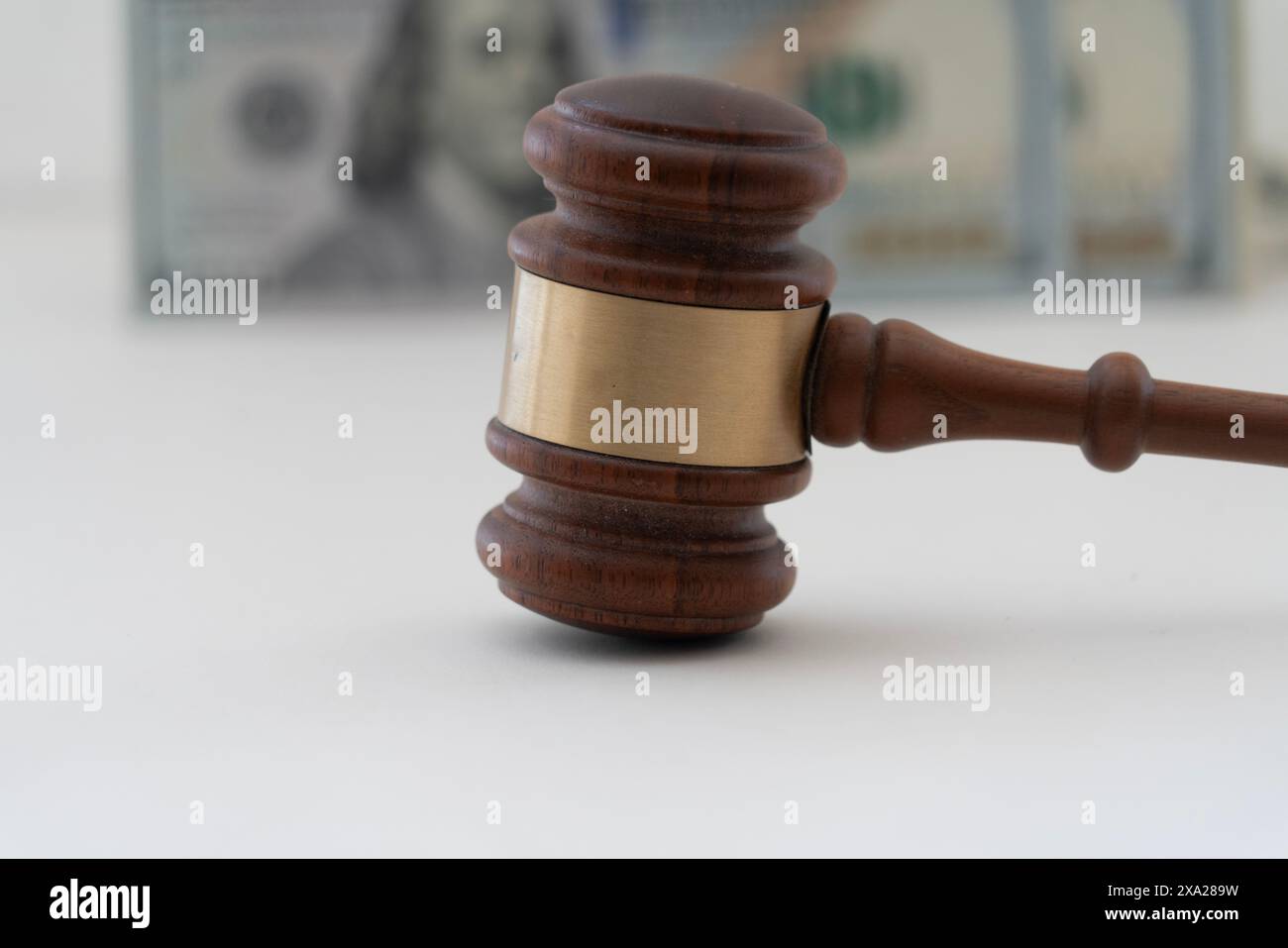 Judges hammer with money to show a judgment paid with cash Stock Photo ...