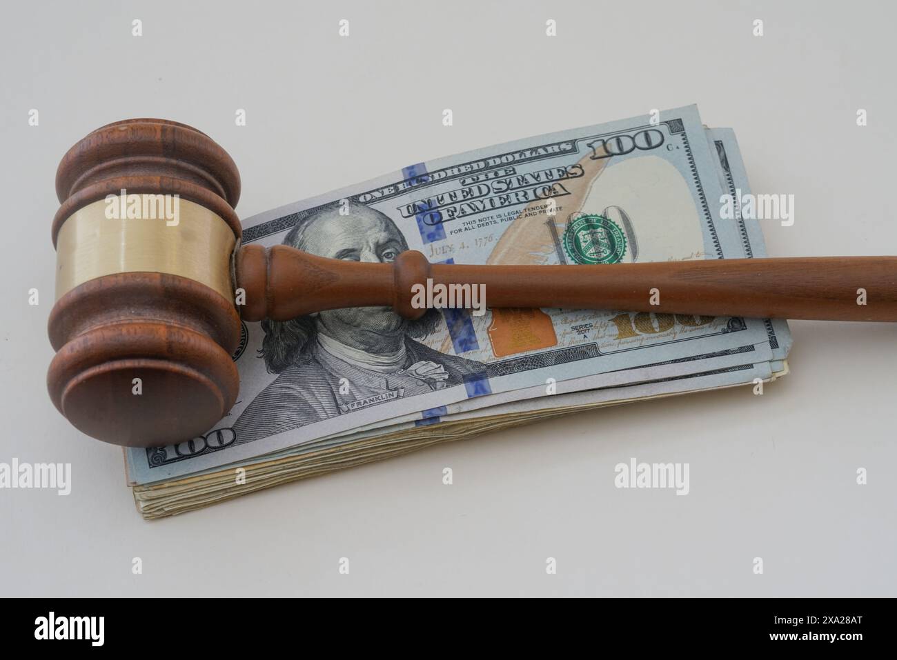 Judges hammer with money to show a judgment paid with cash Stock Photo ...