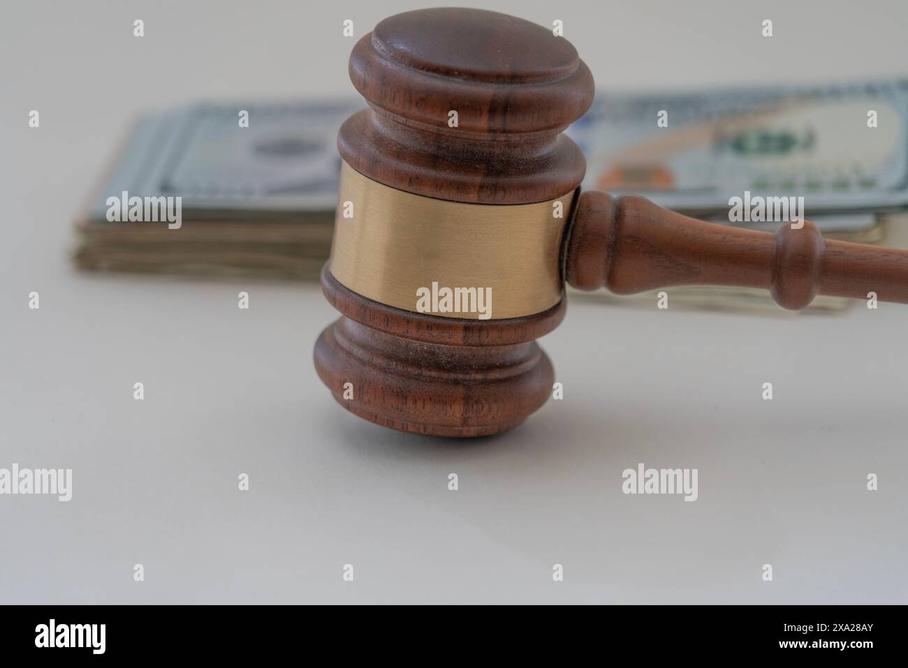 Judges hammer with money to show a judgment paid with cash Stock Photo ...