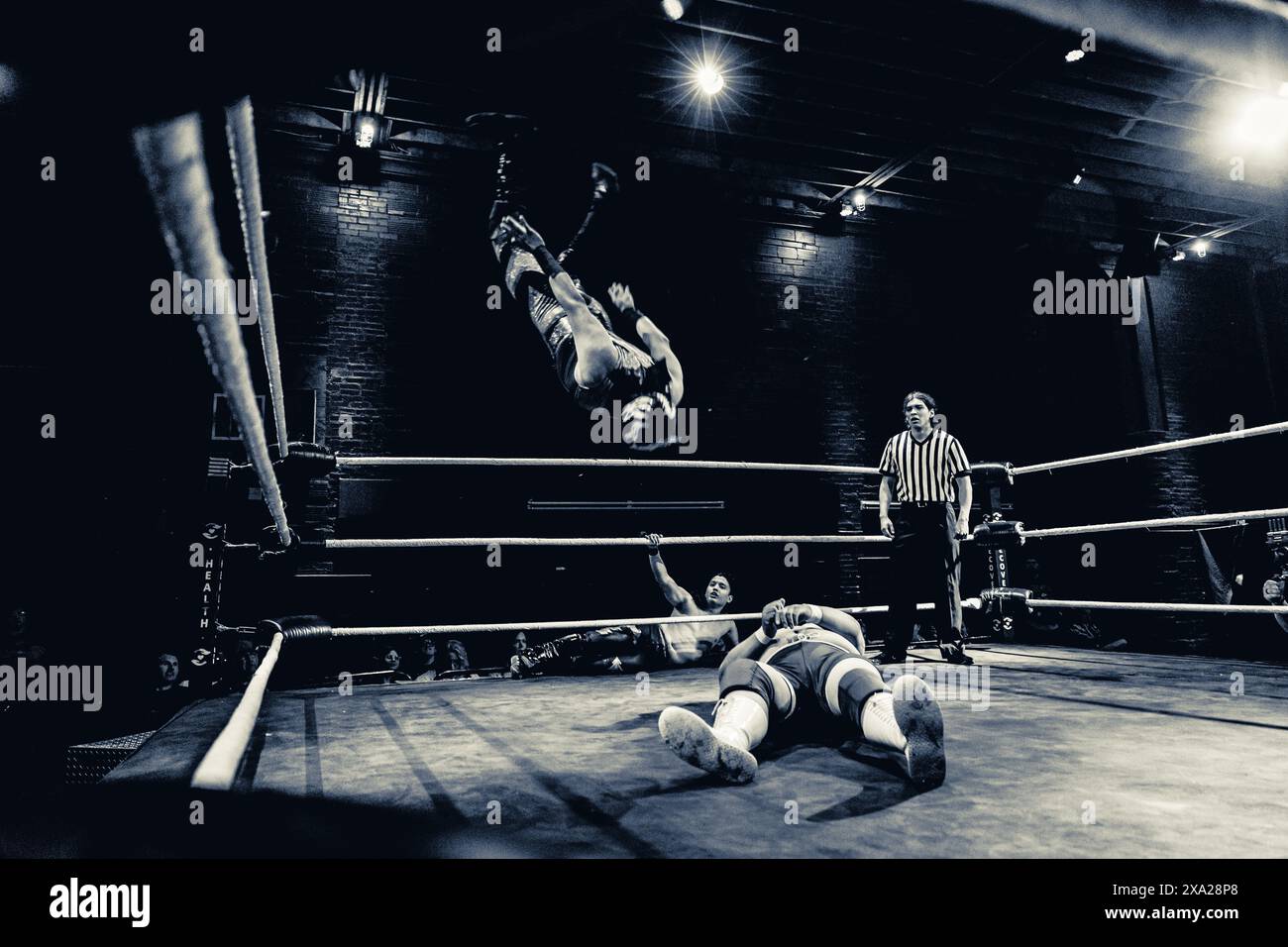 Male boxers facing each other in a well-lit boxing ring Stock Photo - Alamy