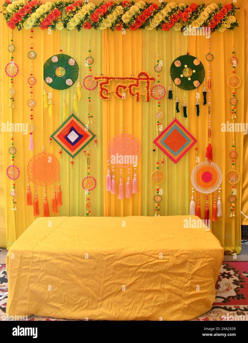 A stage decorated for the traditional Haldi ceremony Stock Photo - Alamy