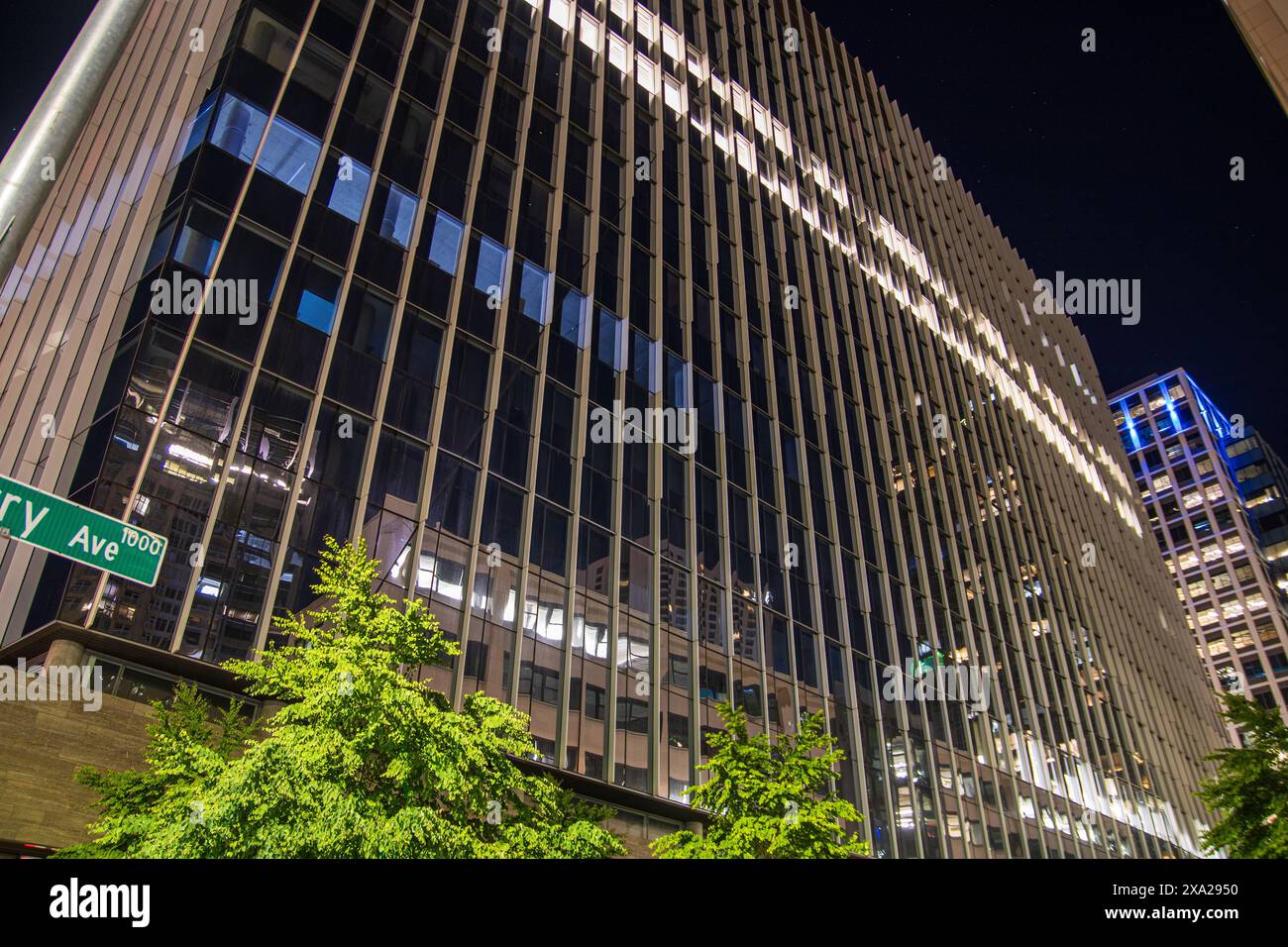 Office building exterior at night from ground level looking up black ...