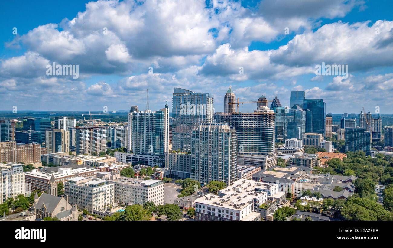 A sprawling metropolis with towering skyscrapers under clear blue skies ...