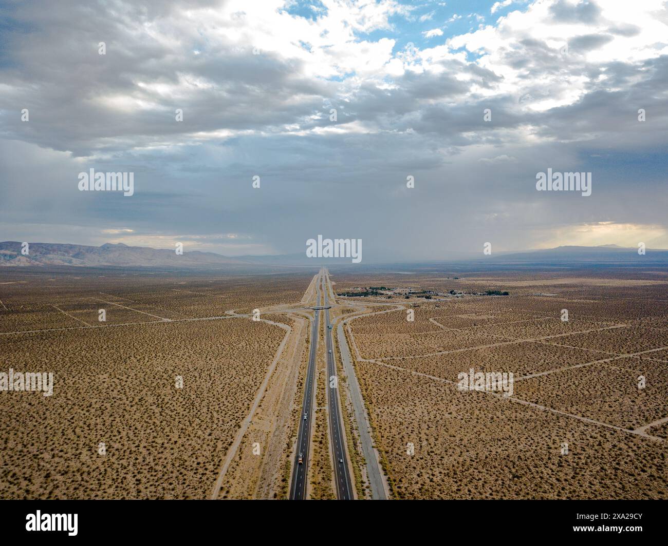 A winding road with a curved path on one side and a divider in the ...