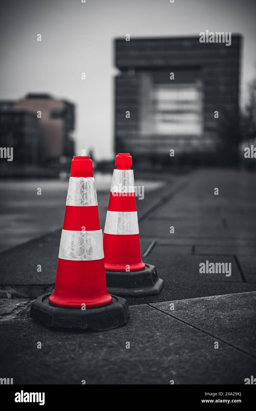 A selective color of traffic cones on ground on the blurry background ...