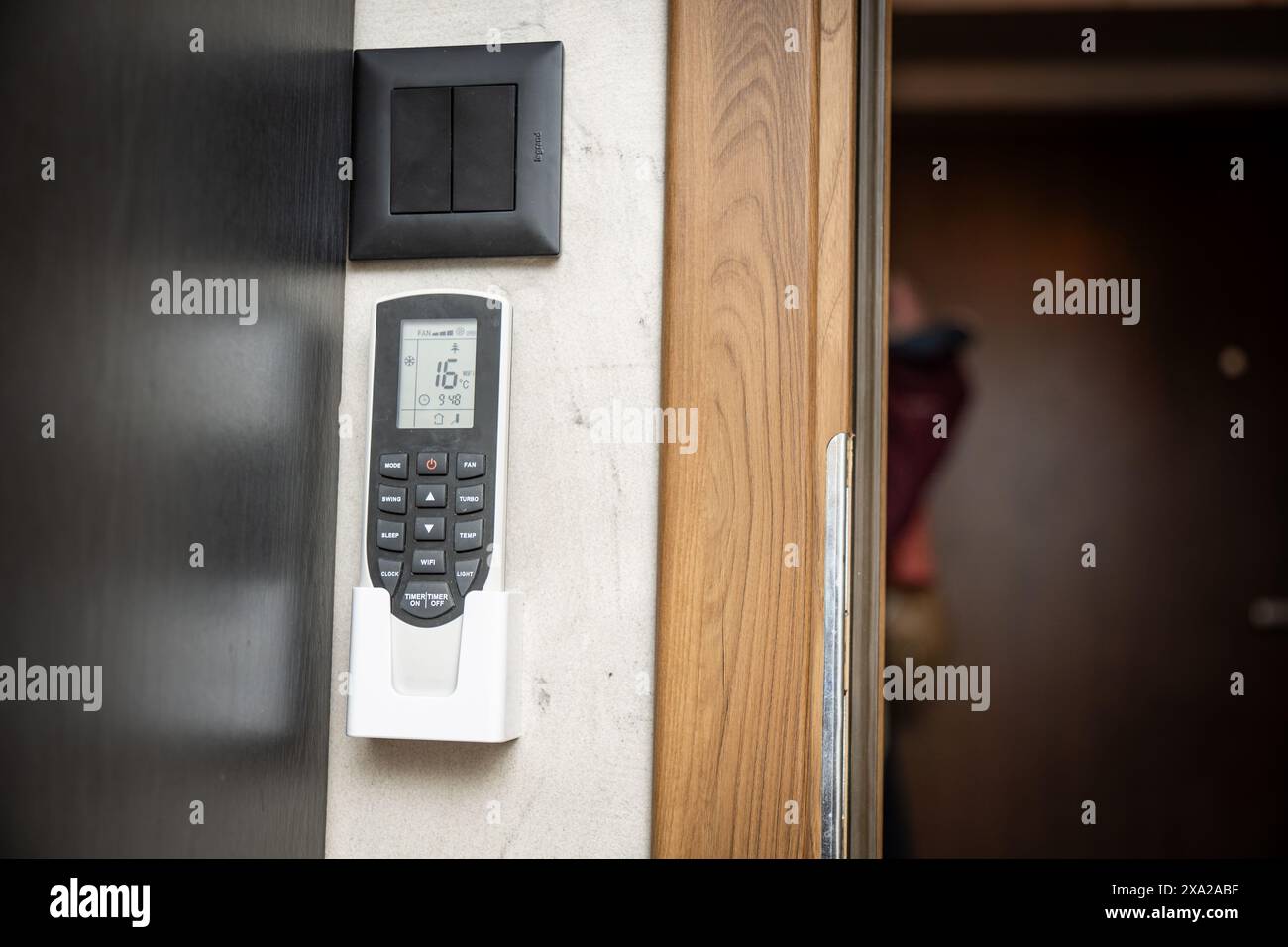 Air Conditioner Remote Control On Wall Stock Photo - Alamy