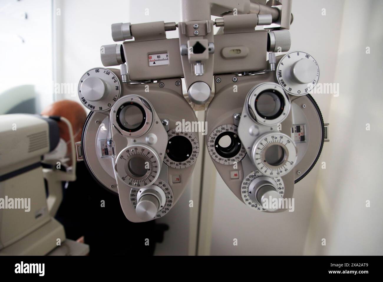 An eye examination room with a visible eye chart on the wall Stock ...
