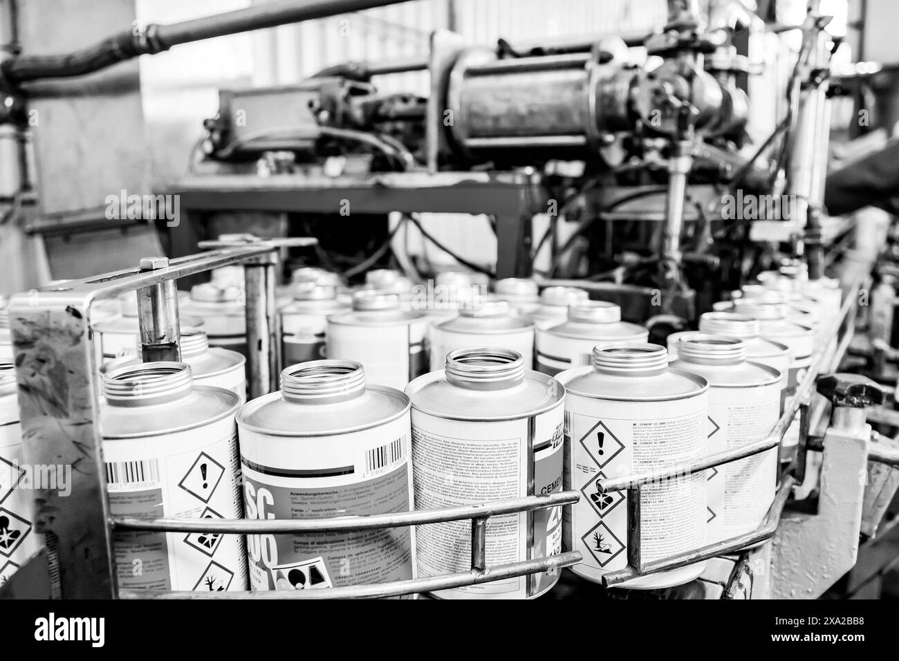 A close-up of empty cans in industrial setting in grayscale Stock Photo ...