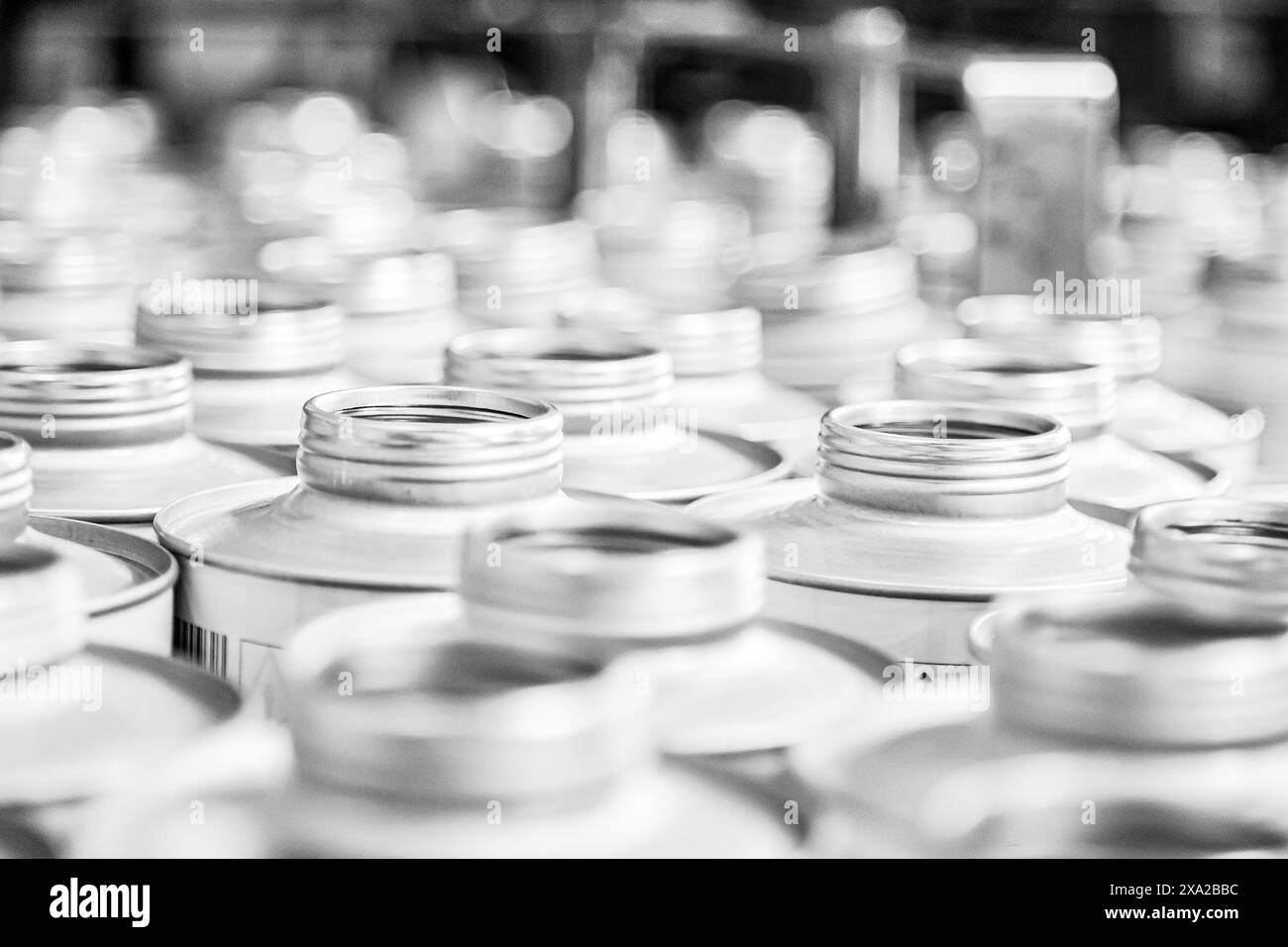 A close-up of empty cans in industrial setting in grayscale Stock Photo ...