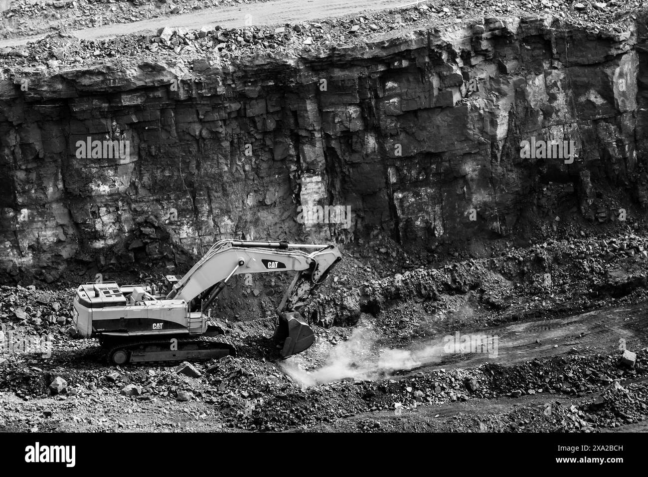 A grayscale of a truck working at a mine Stock Photo - Alamy