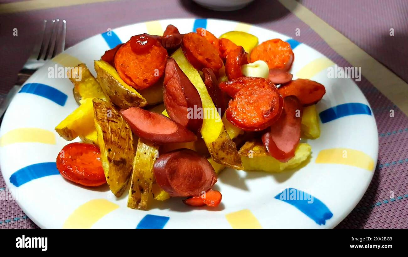 Homemade Peruvian salchipapa with mayonnaise and ketchup Stock Photo ...