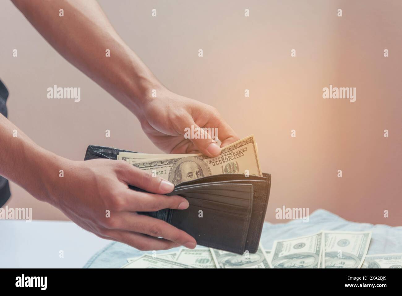 Hand holding money dollar bank note in wallet give financial payment ...