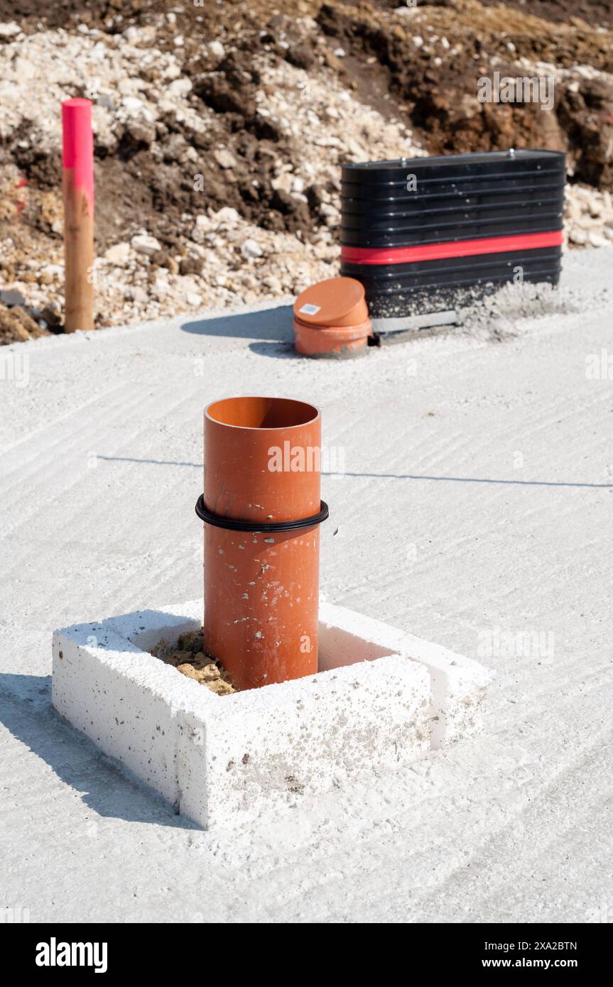 The house and sewage connections in a concrete slab at a construction ...