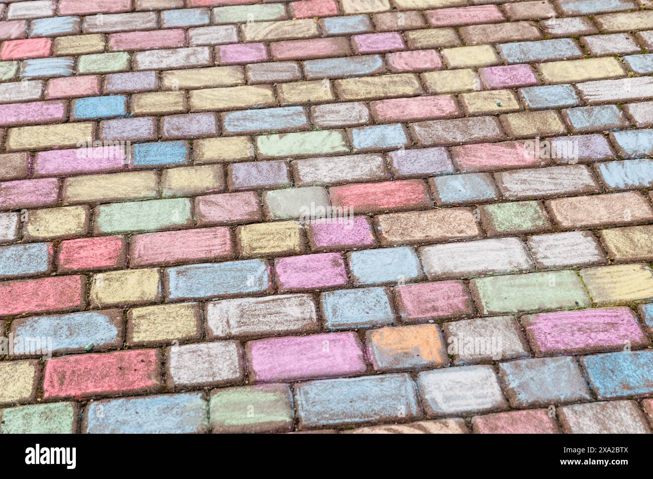 The paving stones painted with colorful street chalk Stock Photo - Alamy