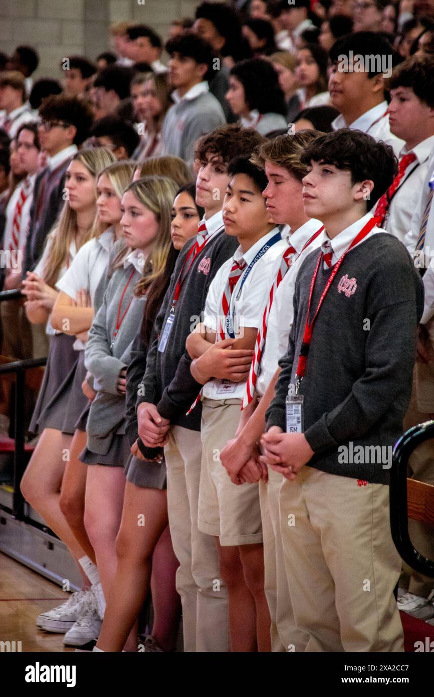 Uniformed Hispanic, Asian and Caucasian students at a Southern California Catholic high school ...