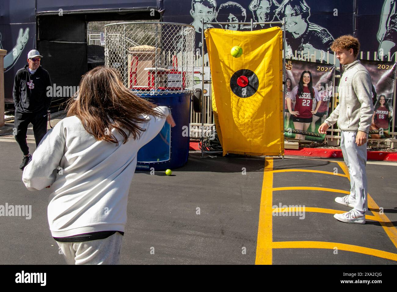 Teenage Southern California high school students throw balls at a ...